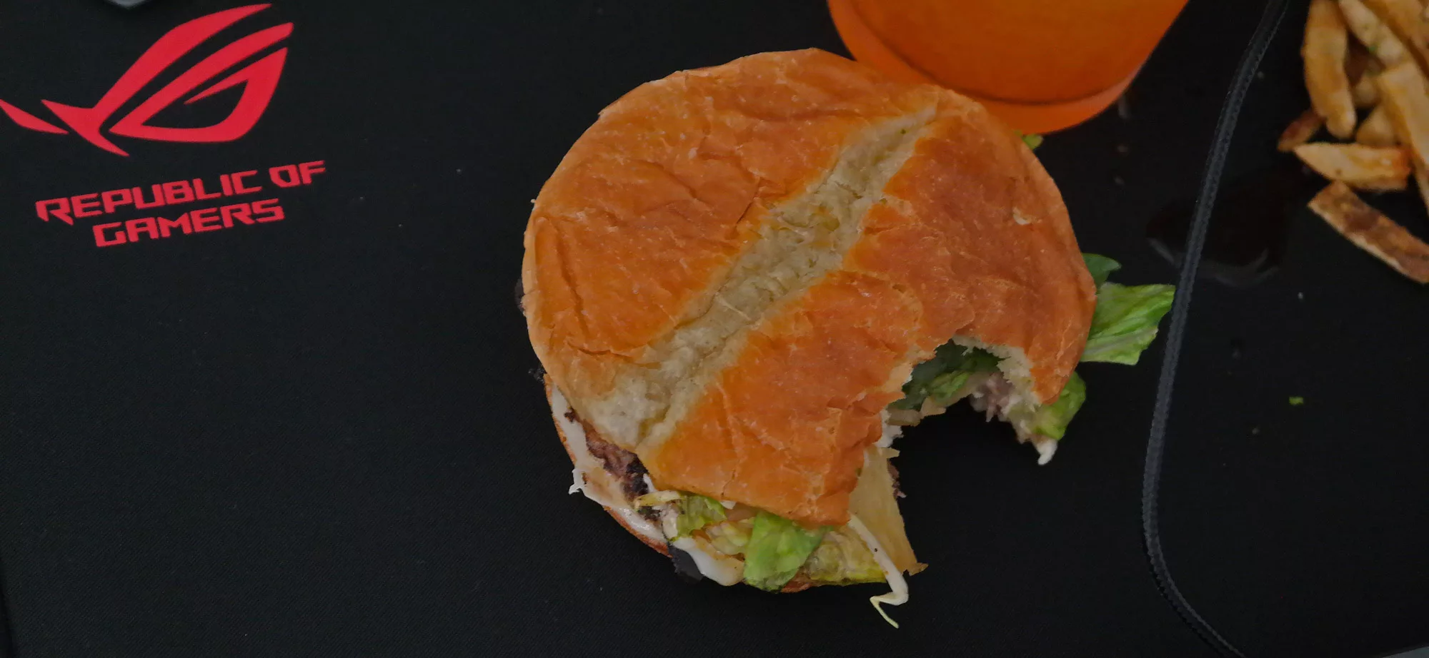 The water-repellent ROG Scabbard desk mat offers ample room for mousing ...